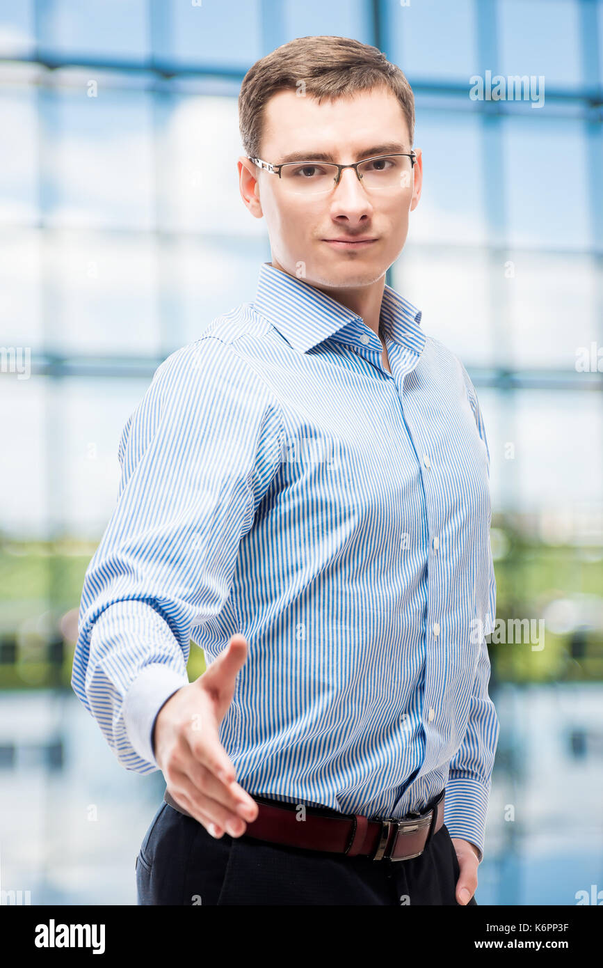 Handsome businessman welcome hand hi-res stock photography and images ...