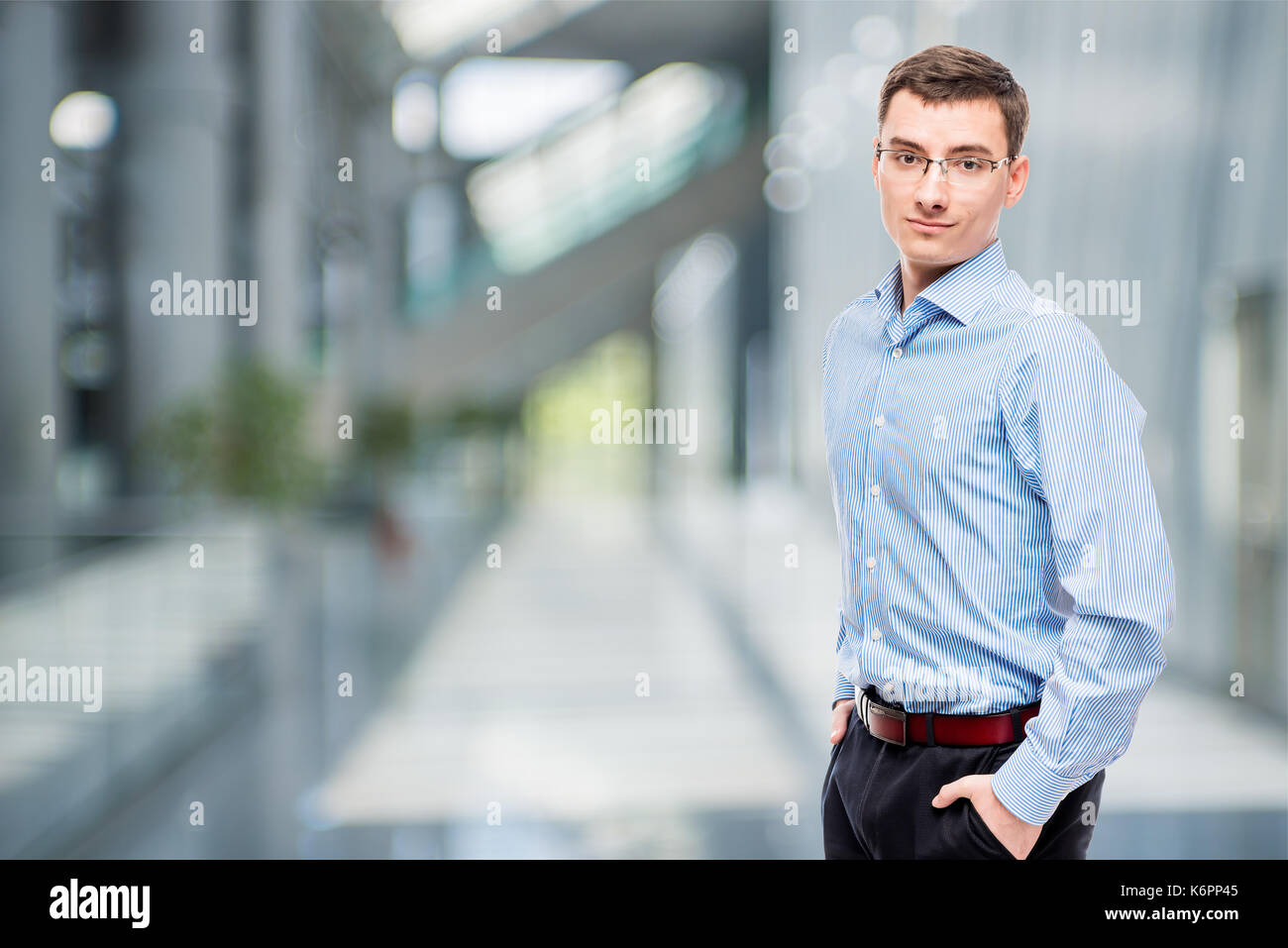 25 year old entrepreneur in blue shirt in office Stock Photo - Alamy