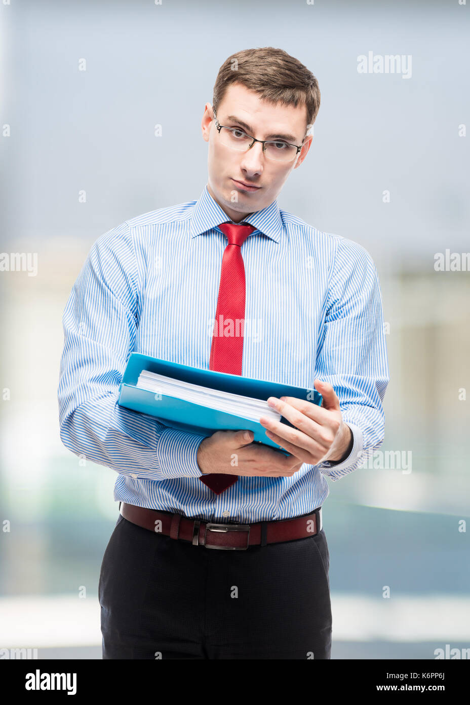 Vertical portrait of chief accountant with folder in the office Stock ...