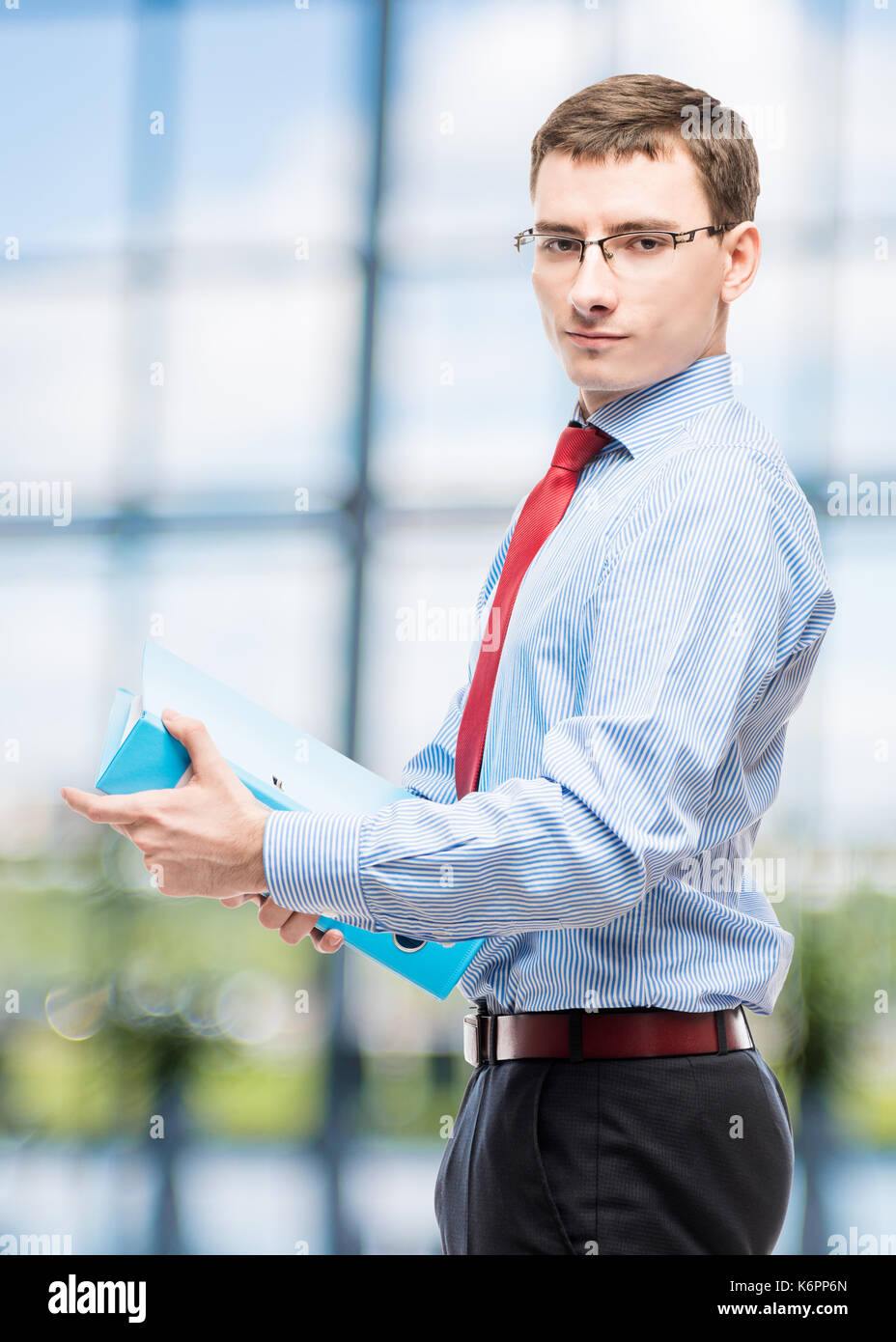 Experienced chief accountant posing in the office with a folder Stock ...