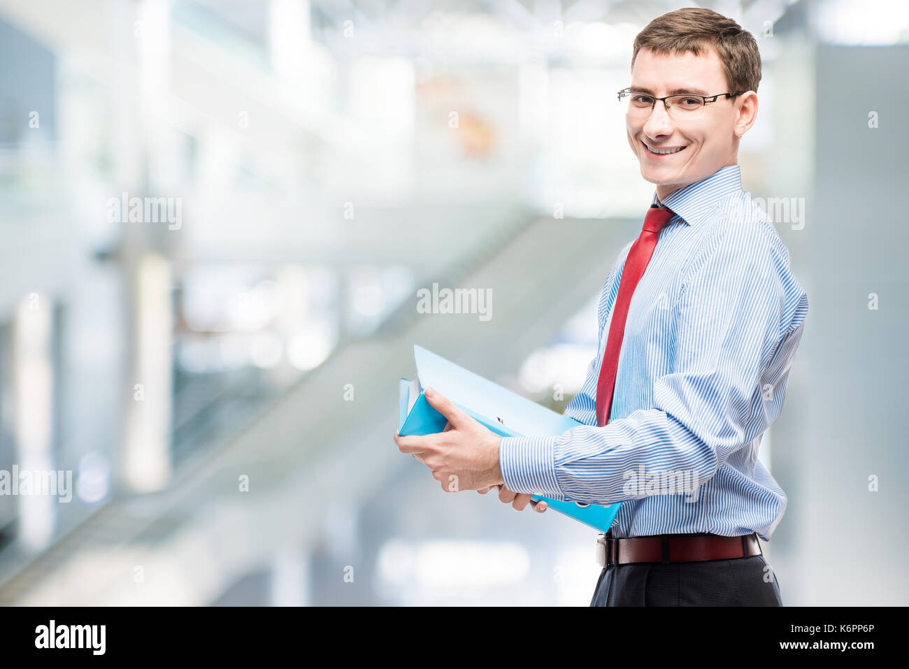 Happy chief accountant with a folder of documents Stock Photo - Alamy