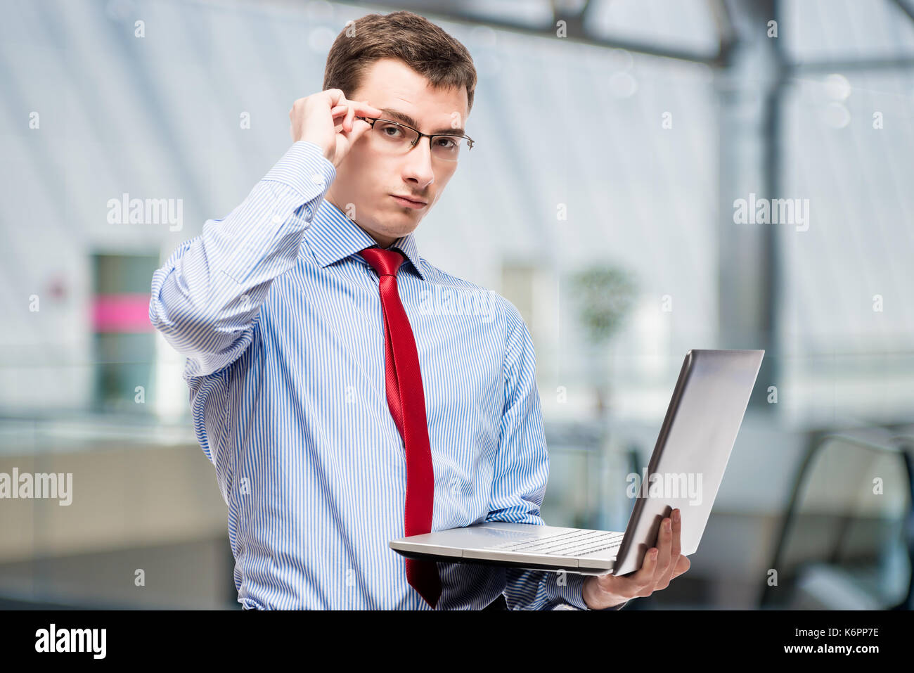Successful accountant with glasses with a laptop in the office Stock ...