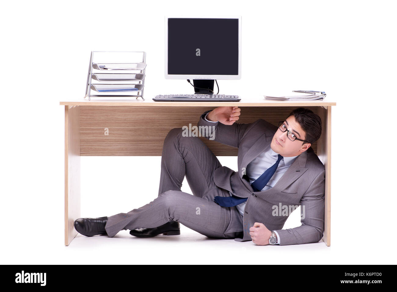 Office Hiding Under Desk Cut Out Stock Images & Pictures - Alamy