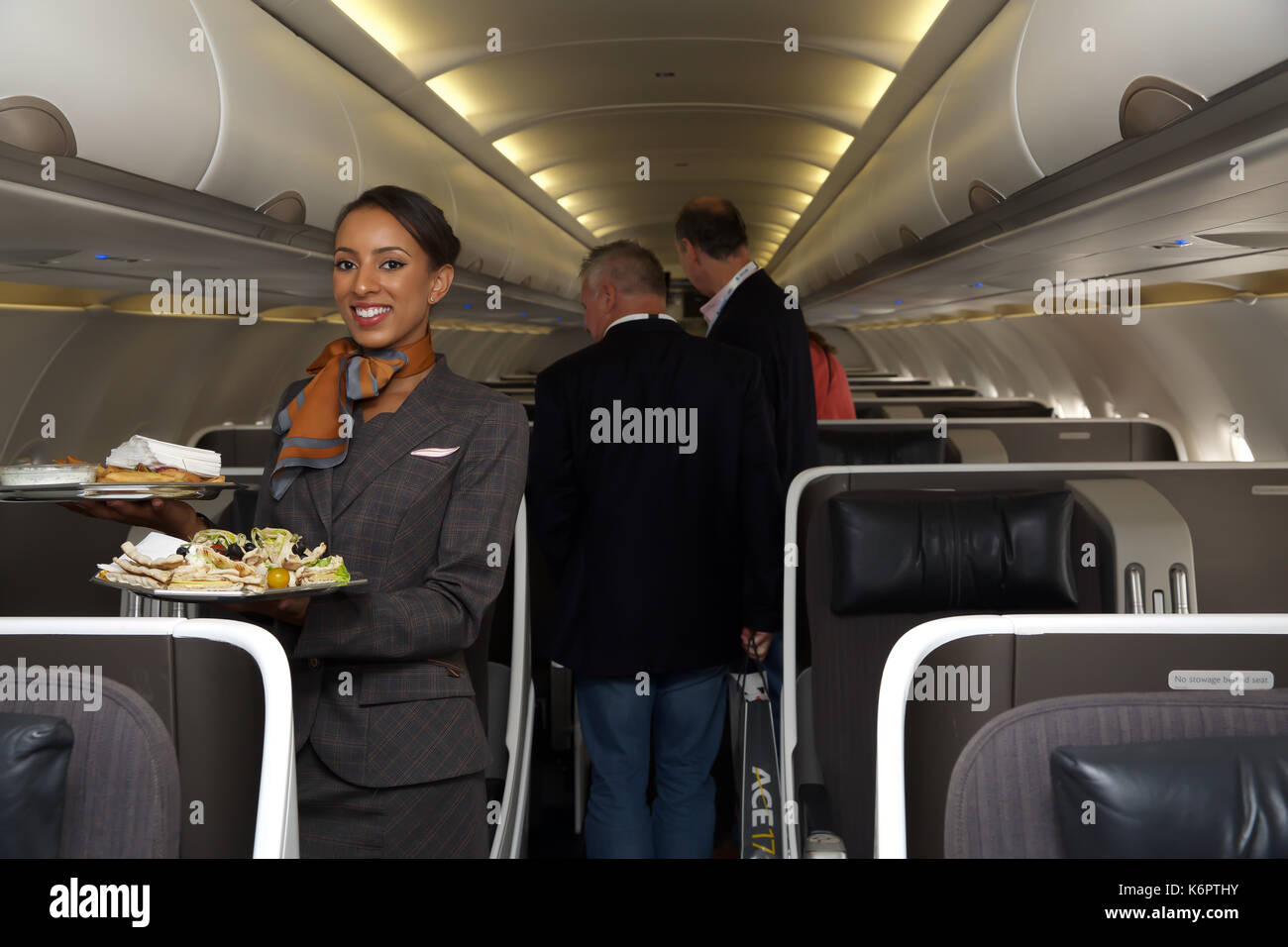 Air steward on board a plane at the Air Charter Expo 2017 at London ...