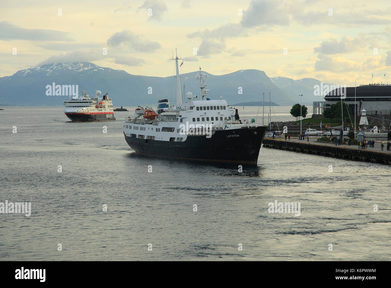 Two Hurtigruten ferry ships arriving at Molde, Norway the Lofoten is ...