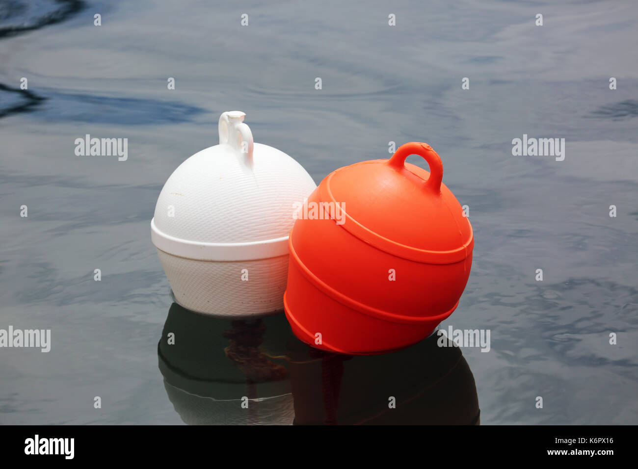 Orange maritime buoy floating hi-res stock photography and images - Alamy
