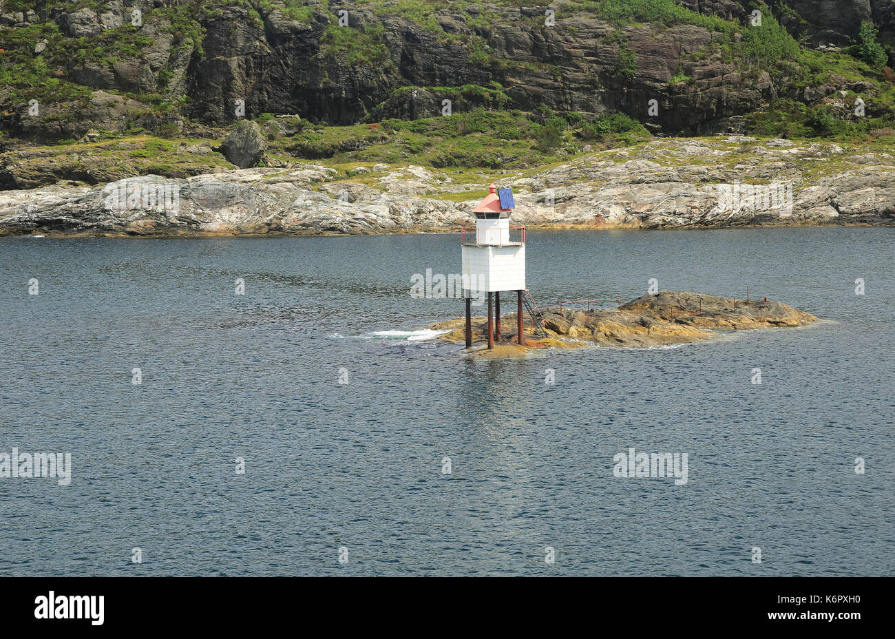 Navigation marker beacon for shipping on small rocky island, north of ...