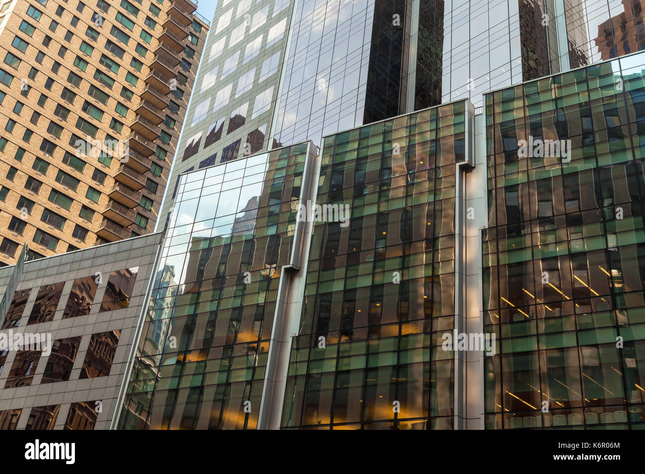 A close up of the reflections on the glass windows of the high rises in ...
