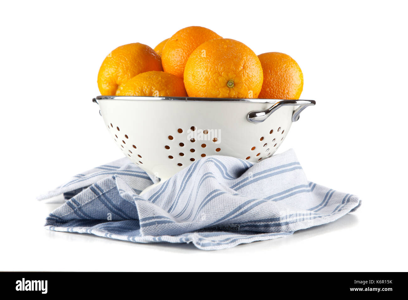Fresh oranges in a colander Stock Photo - Alamy