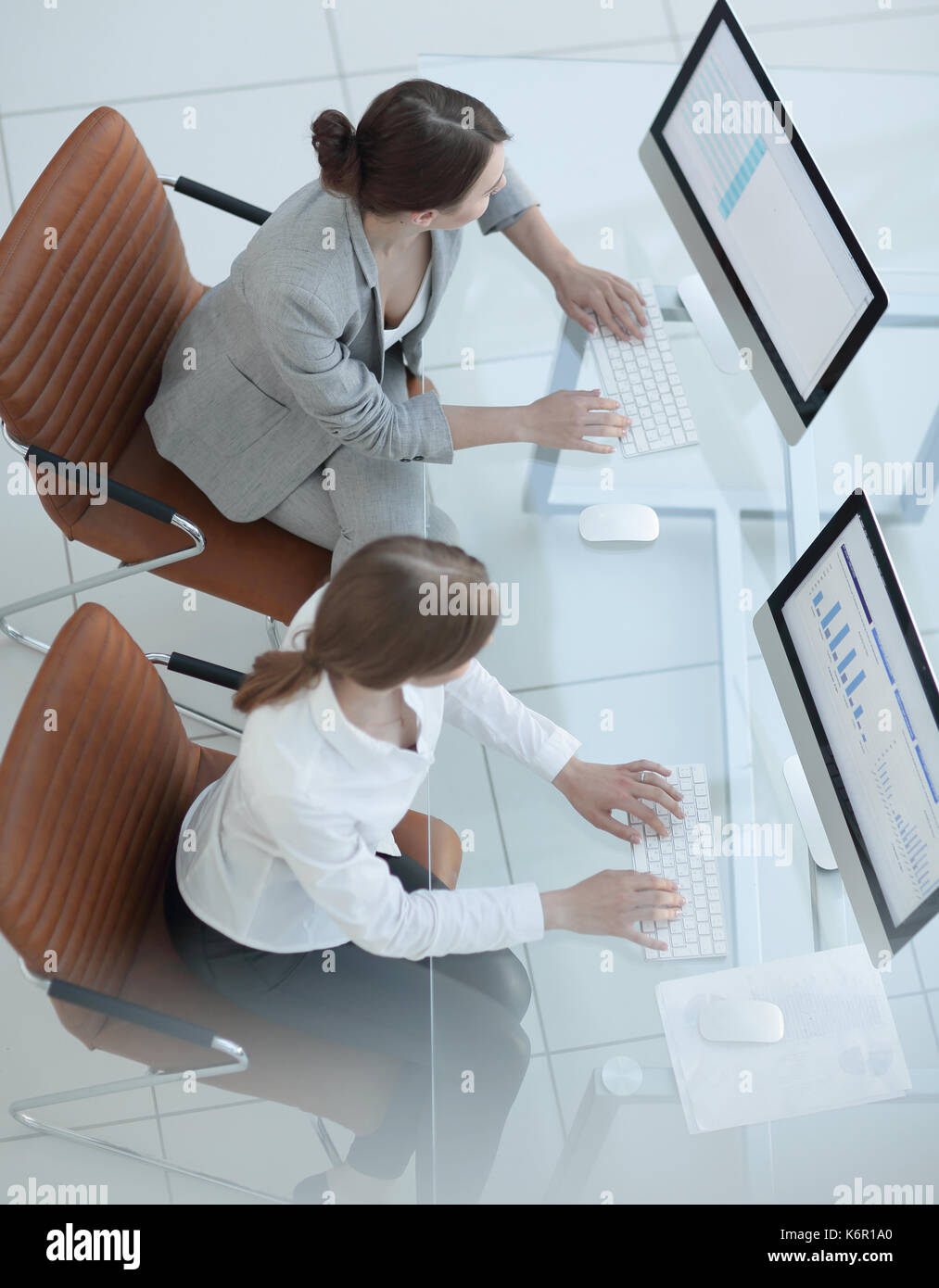 staff of the planning Department sitting behind a Desk Stock Photo - Alamy
