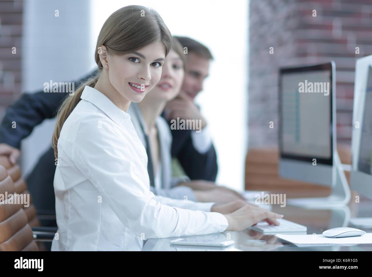employees working on personal computers with financial data Stock Photo ...
