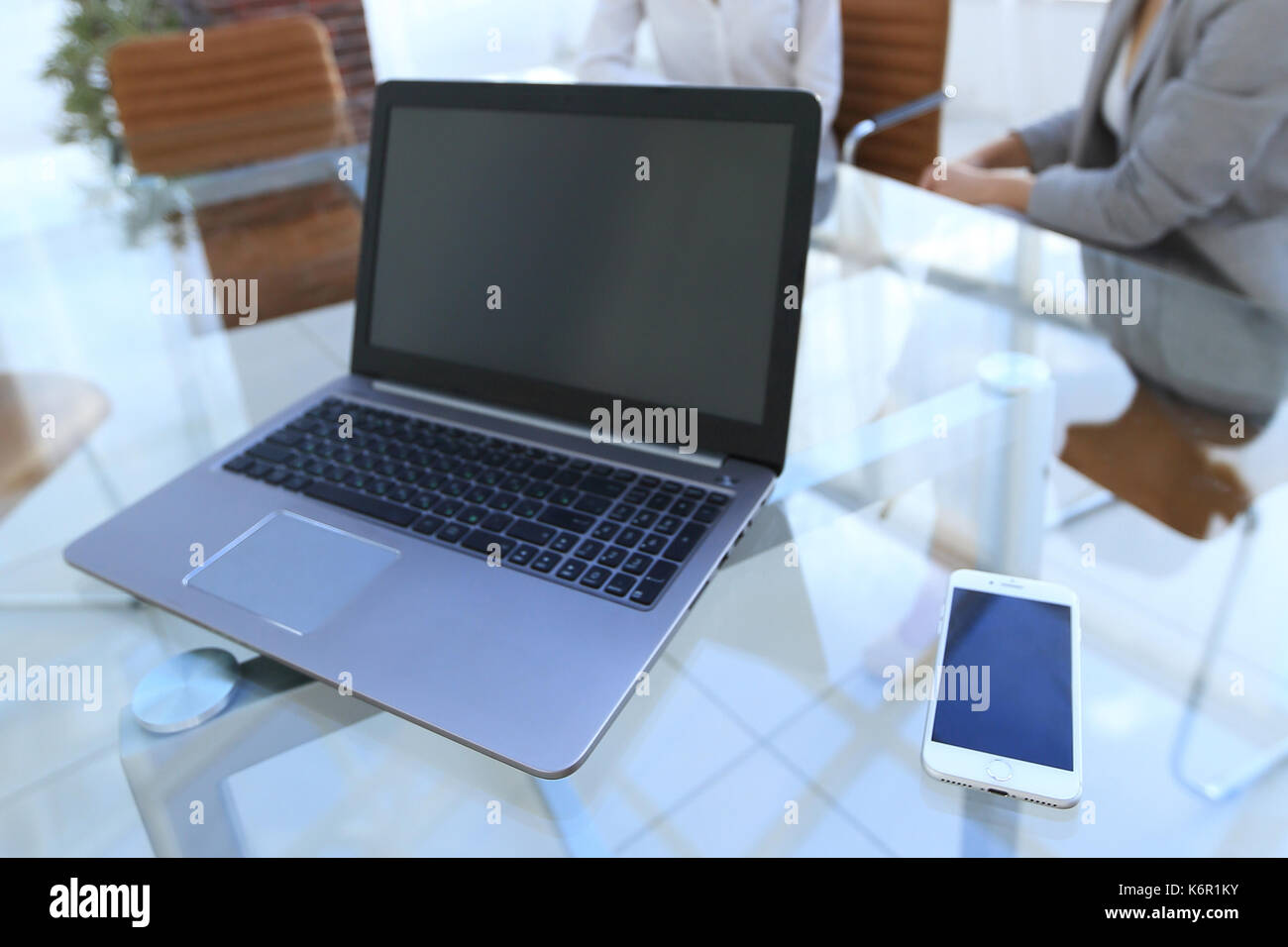 laptop and a smartphone on the desktop of a businessman Stock Photo - Alamy
