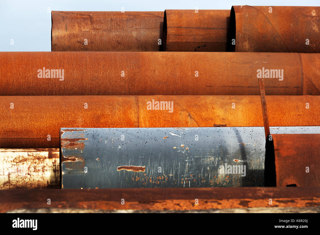 Stack of industrial reusable rusty metal pipes Stock Photo - Alamy