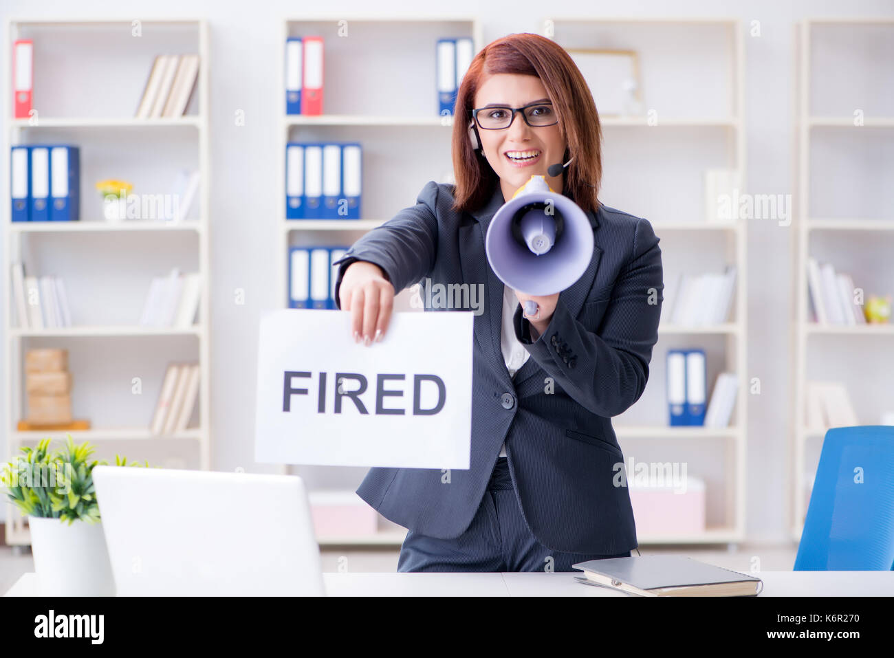 Businesswoman firing people in office Stock Photo - Alamy