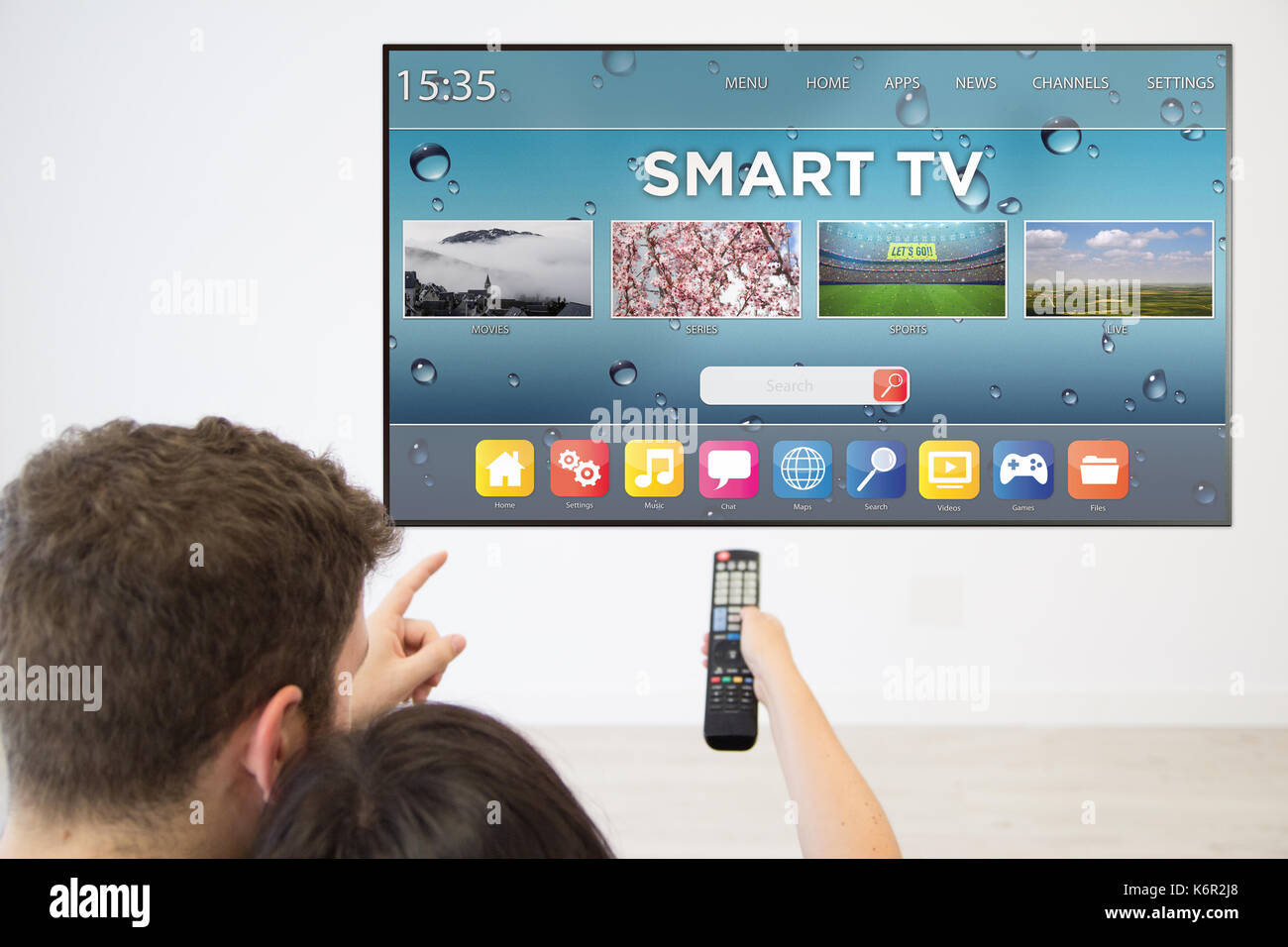 back view couple watching smart tv on television at home Stock Photo ...