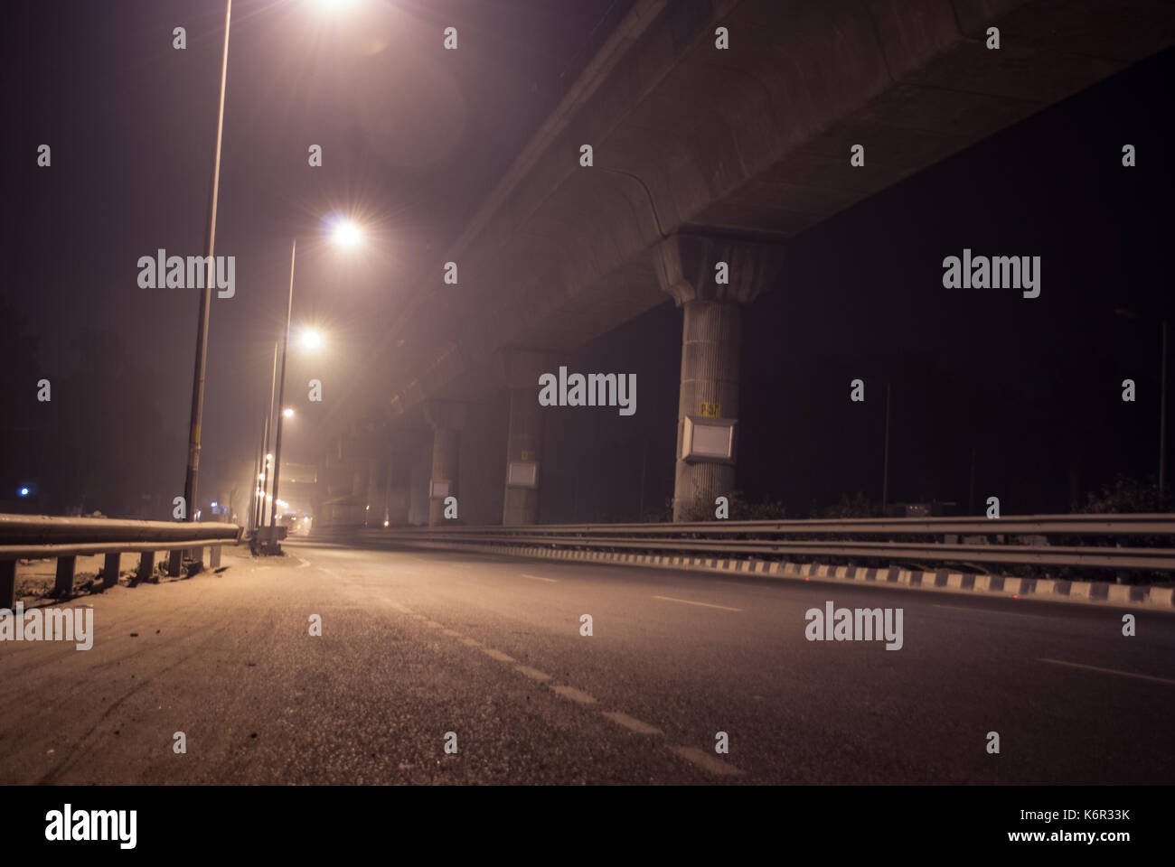 Empty road at night Stock Photo - Alamy