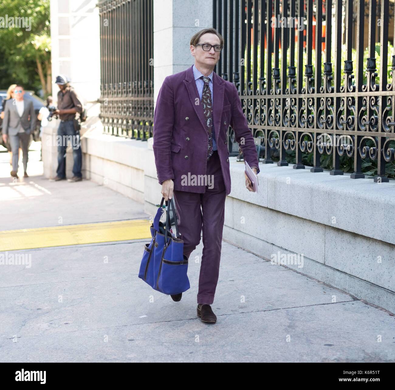 Purple pants suit hi-res stock photography and images - Alamy