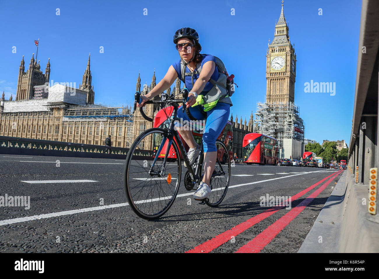 London, UK. 13th Sep, 2017. Cyclists ride on Westminster Bridge under ...