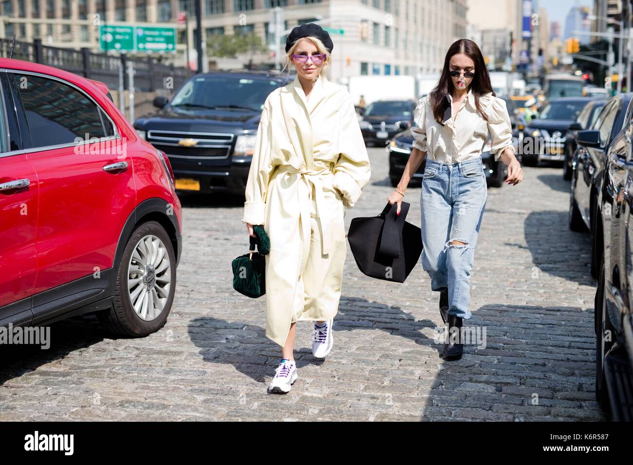 Bloggers Caroline Daur and Evangelie Smyrniotaki posing outside of the ...