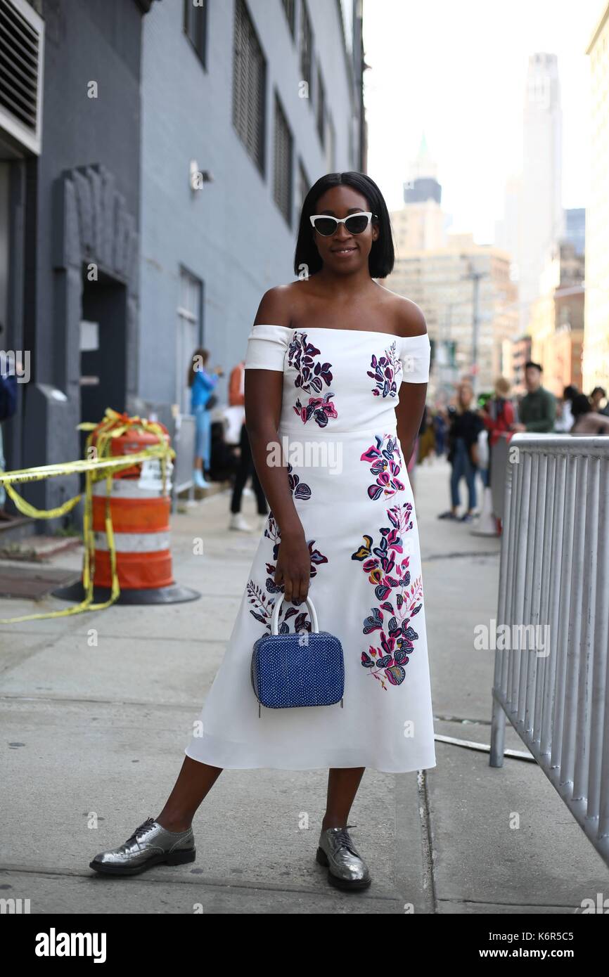 Chrissy Rutherford, Senior Editor at Harper's Bazaar posing outside of ...