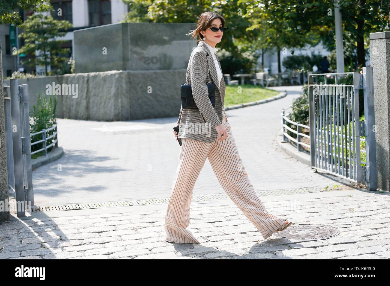 Blogger Carmen Grace Hamilton posing outside of the Zimmermann runway ...