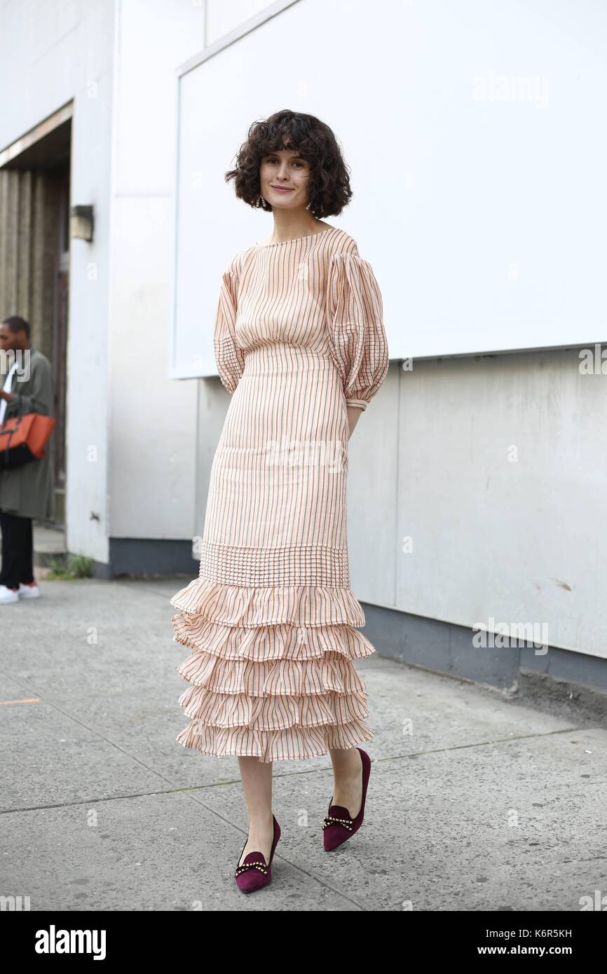 Stylist Chloe Hill posing outside of the Zimmermann runway show during ...