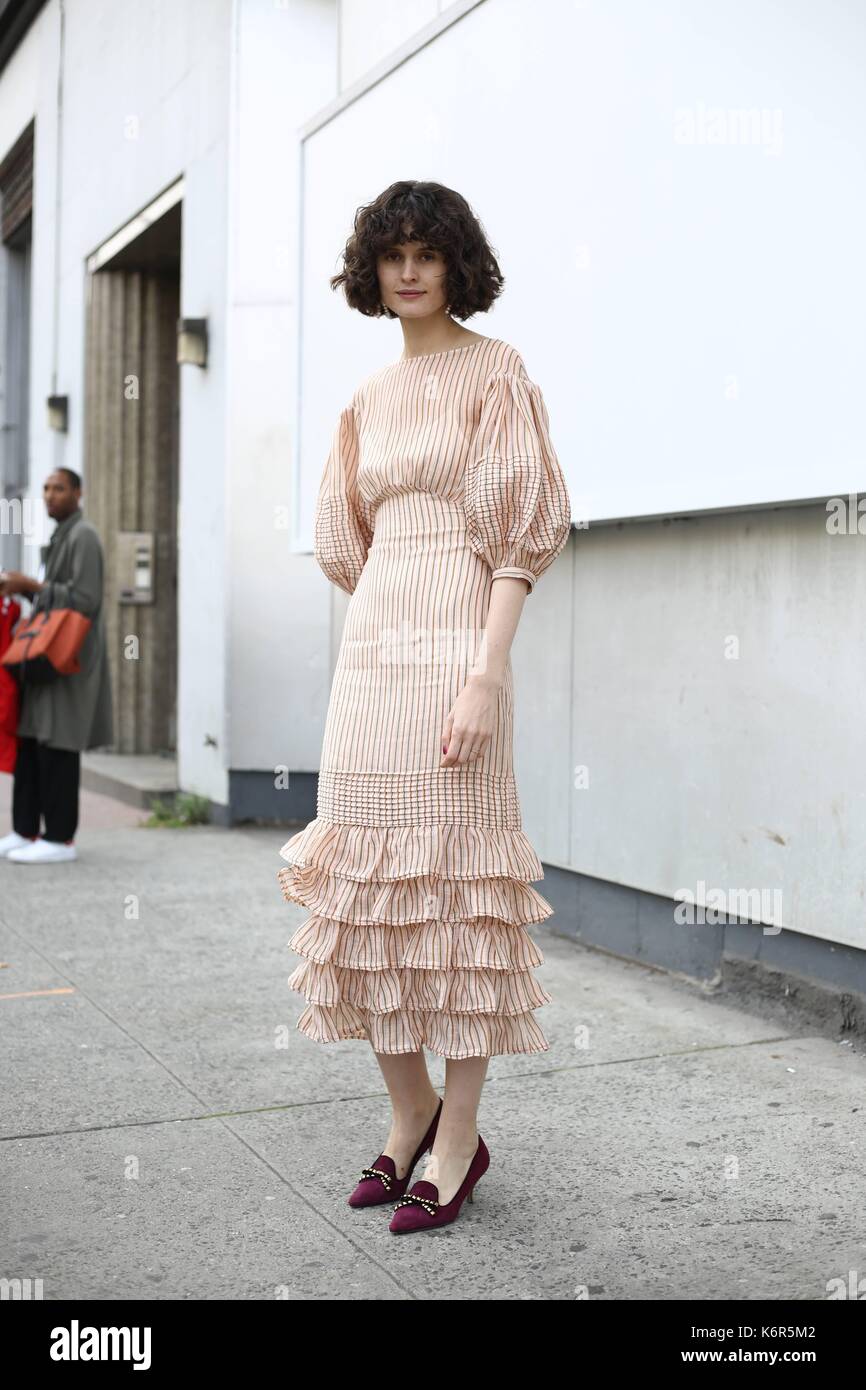 Stylist Chloe Hill posing outside of the Zimmermann runway show during ...