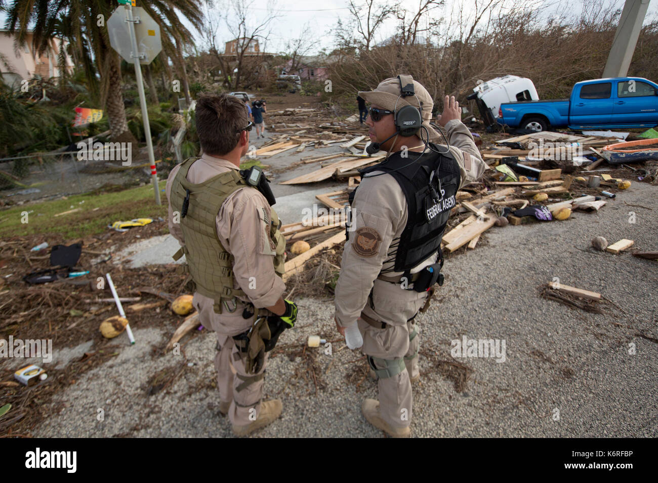 U.S. Customs and Border agents view the destruction in the aftermath of ...