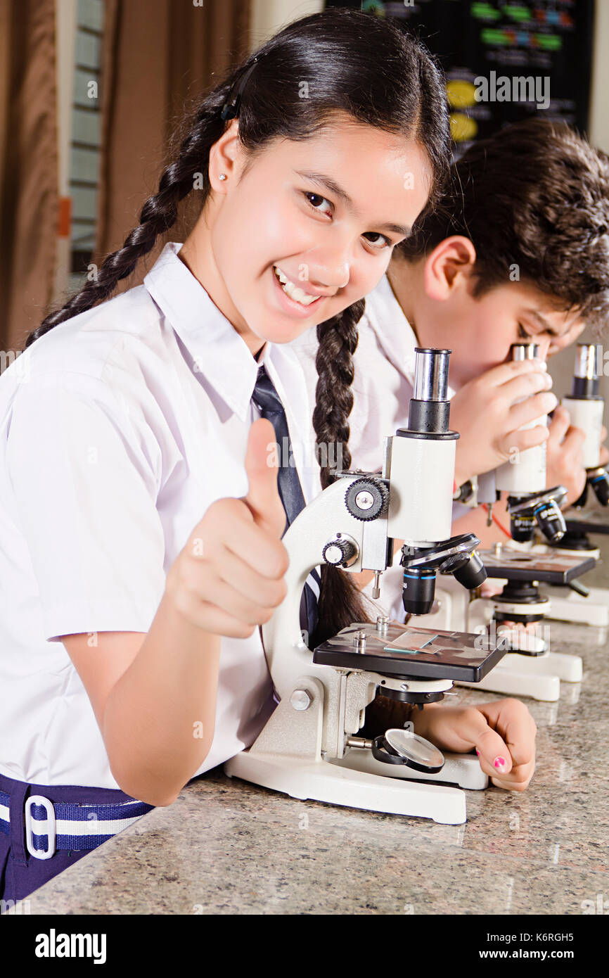 3 Indian School Students Checking Microscope Science Lab Research And ...