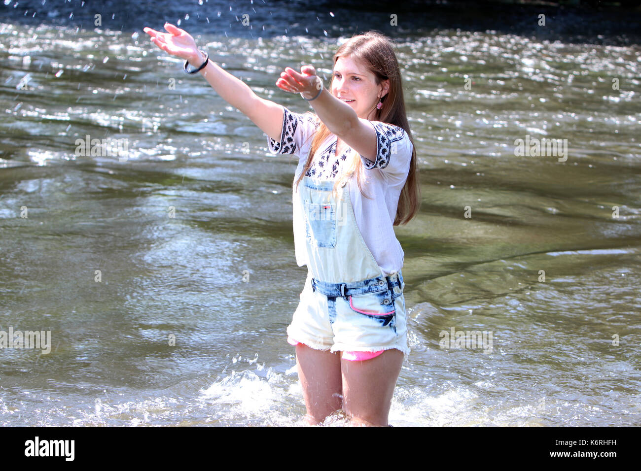 Woman with freckles and hot pants while fishing Stock Photo - Alamy