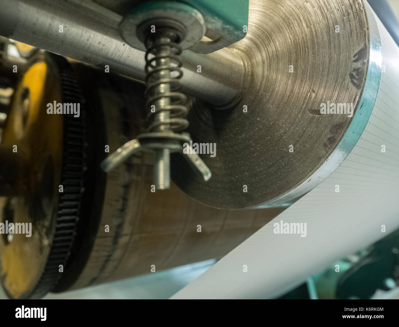 A roll of paper installed in a typographic machine Stock Photo - Alamy
