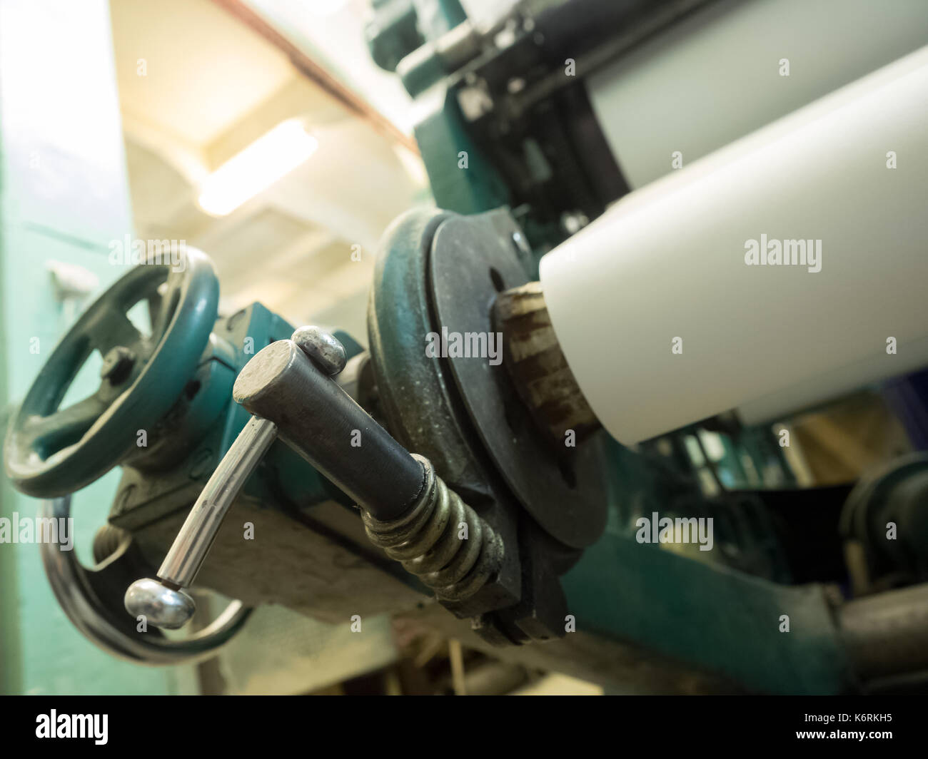 A roll of paper installed in a typographic machine Stock Photo - Alamy