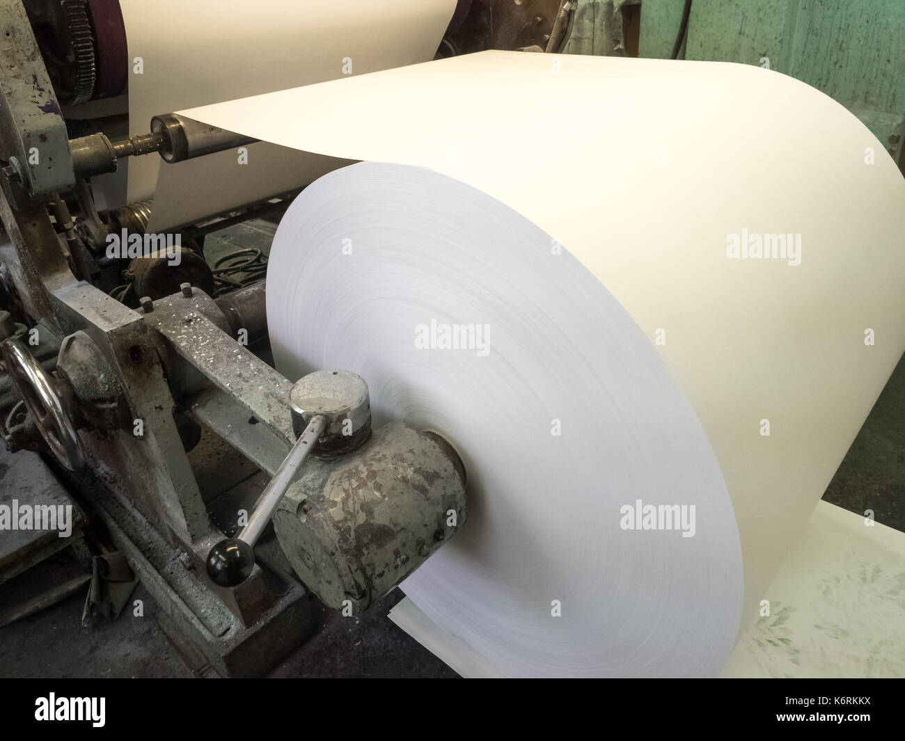 A roll of paper installed in a typographic machine Stock Photo - Alamy
