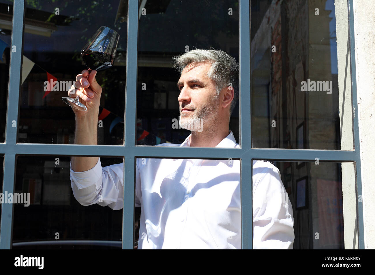 Red wine, perfect bouquet and color. Sommelier tasting wine Relax after ...