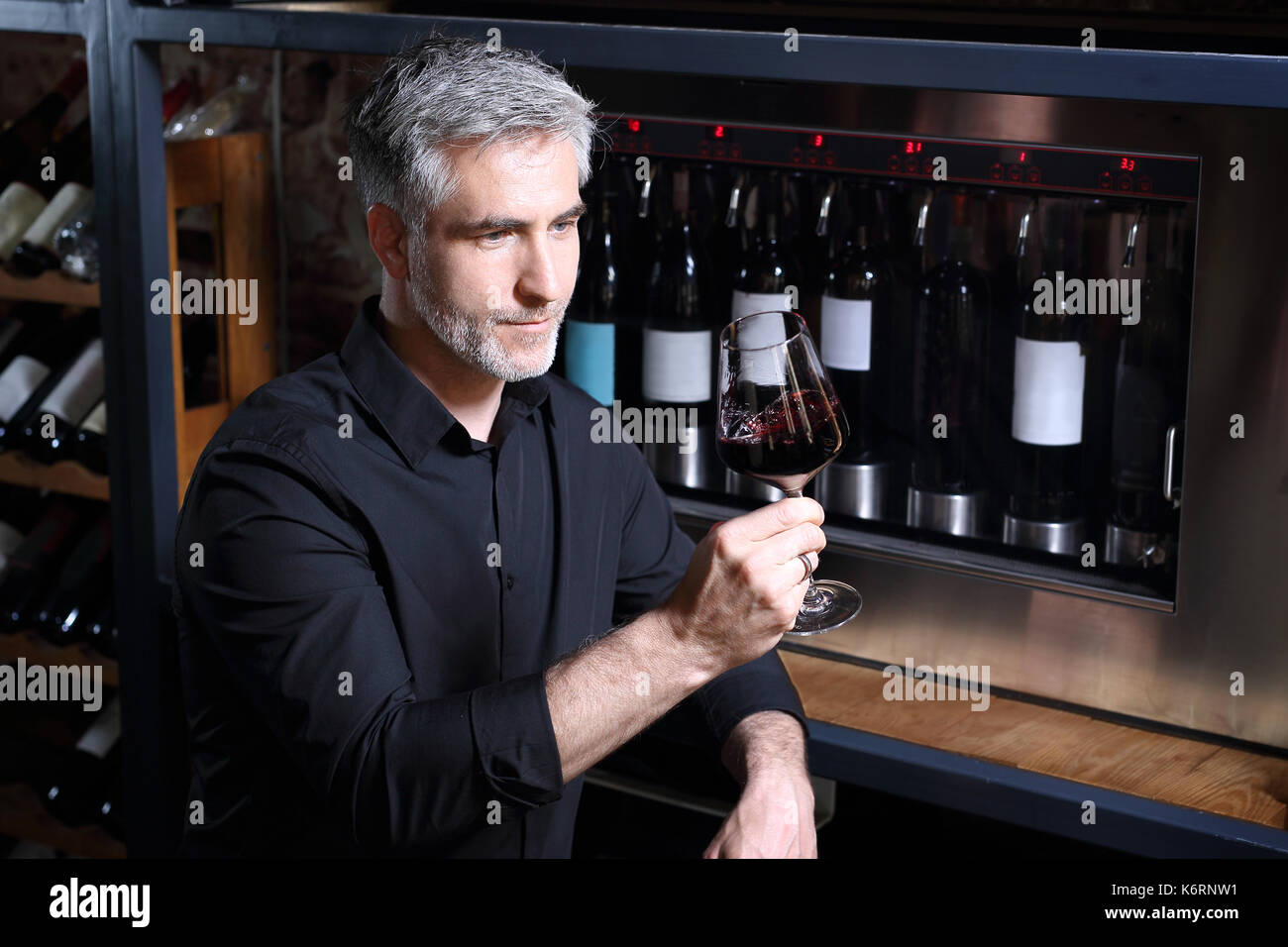 Sommelier in the restaurant evaluates the vintage Stock Photo - Alamy