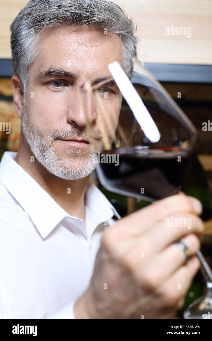 Sommelier tasting red wine Stock Photo - Alamy