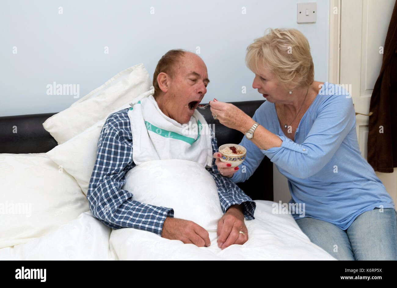 Sick bedridden man food wife hi-res stock photography and images - Alamy