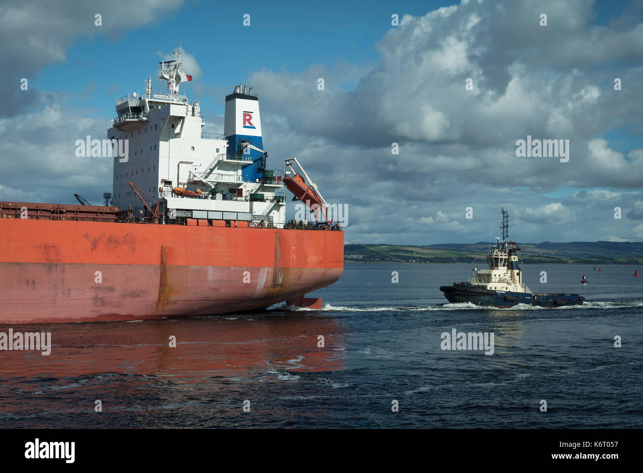 Tug on River Clyde with Container Vessel Jaguar Max Stock Photo - Alamy