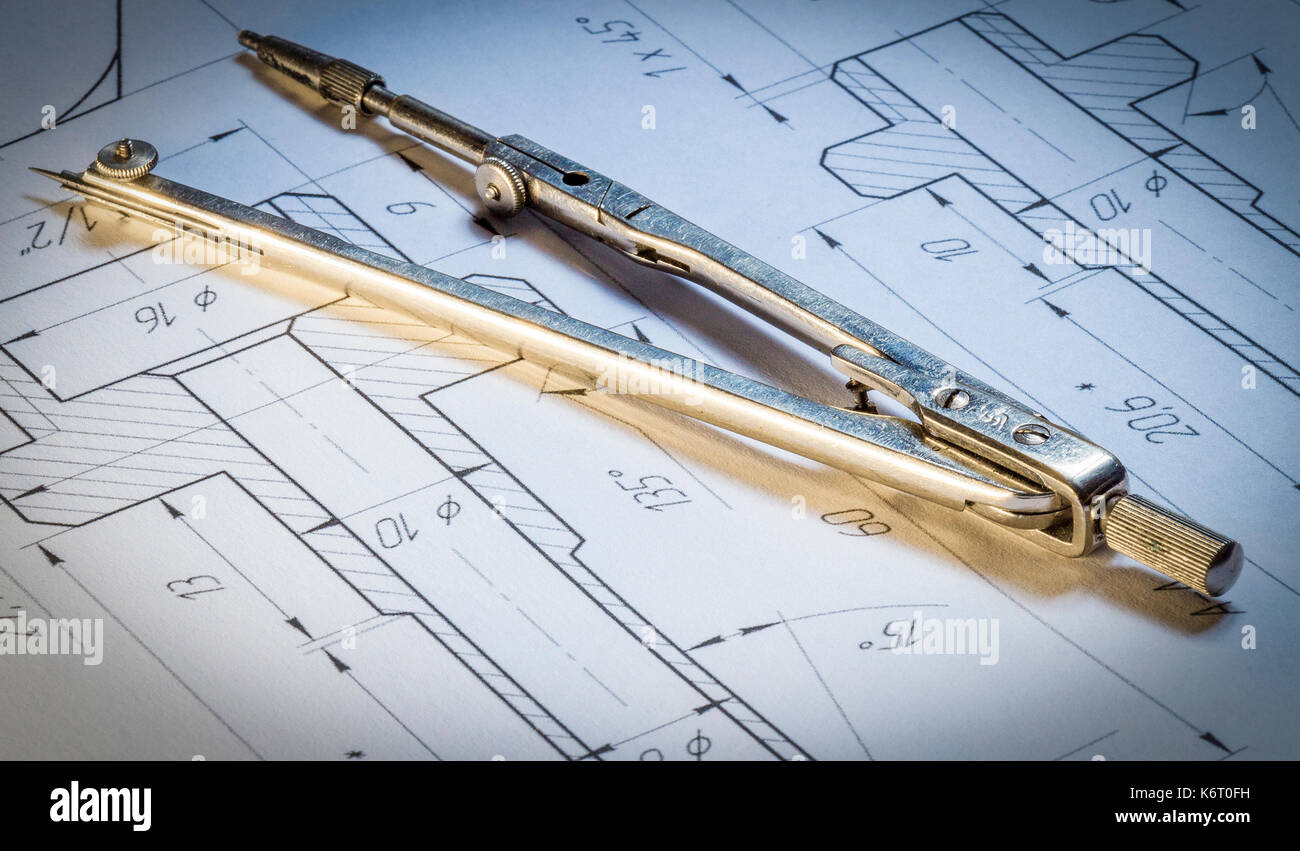 Lying drawing compasses closeup on the detail drawing Stock Photo - Alamy