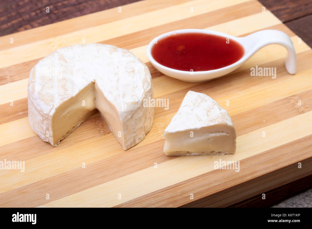 Cheese with white mold. Camembert or brie type with Cranberry sauce ...