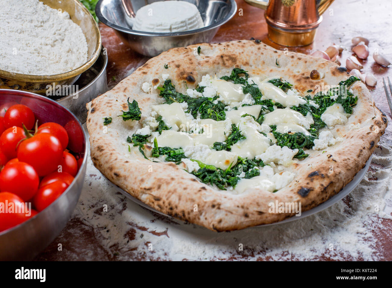 Traditional italian pizza with mozzarella cheese, ricotta and spinach ...