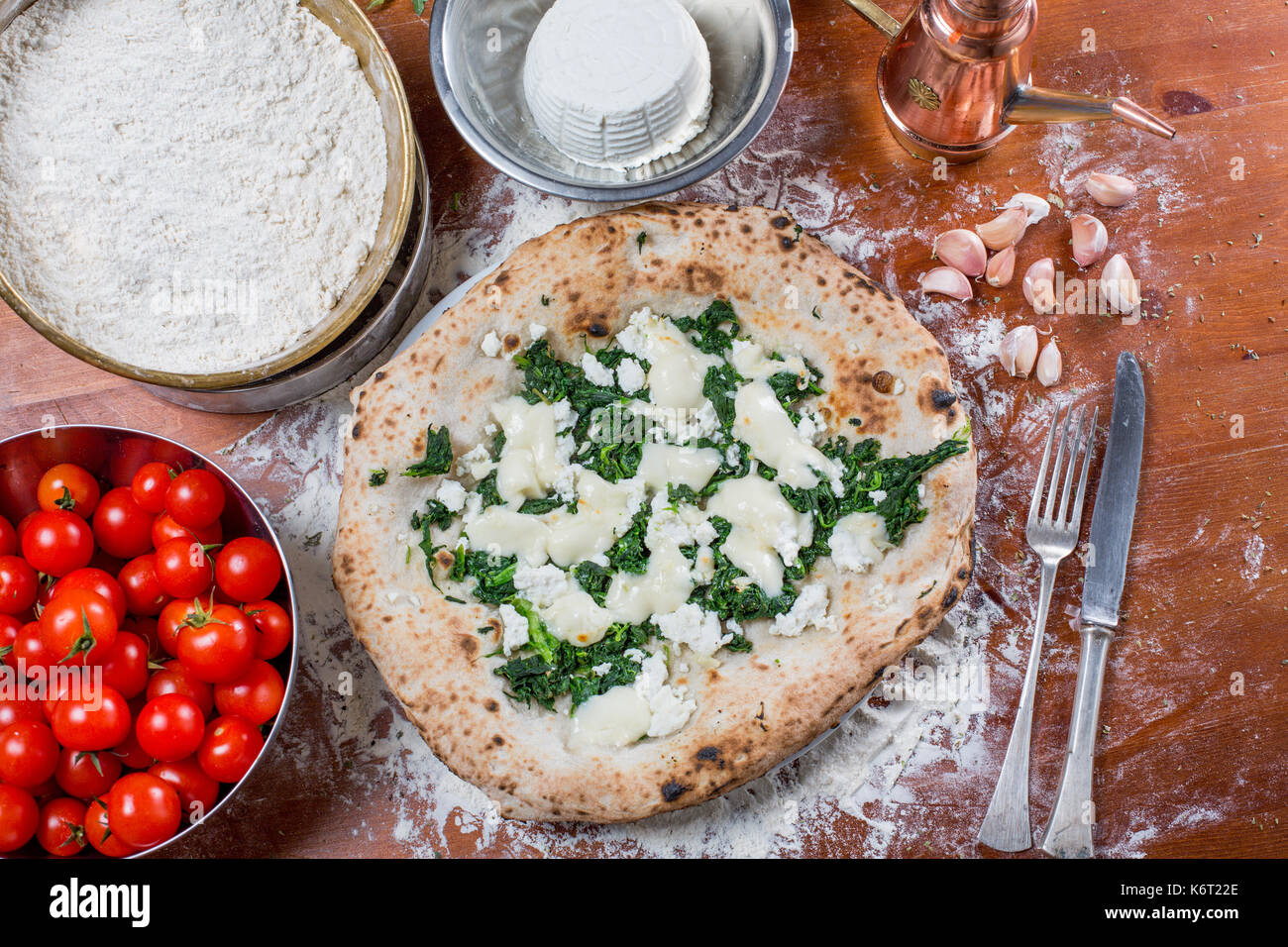 Traditional italian pizza with mozzarella cheese, ricotta and spinach ...