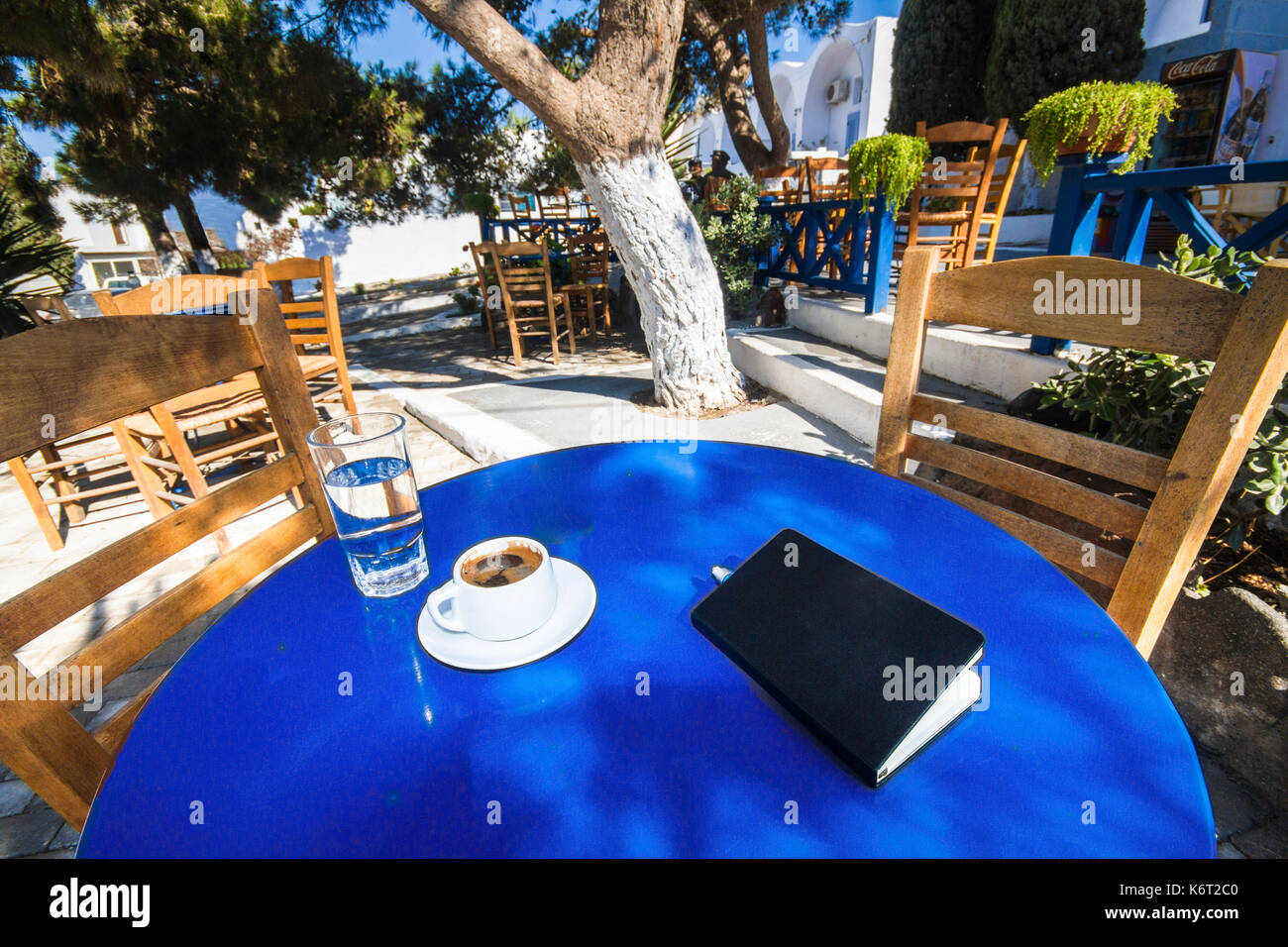 Cup of Greek coffee and water in traditional greek cafe Stock Photo - Alamy