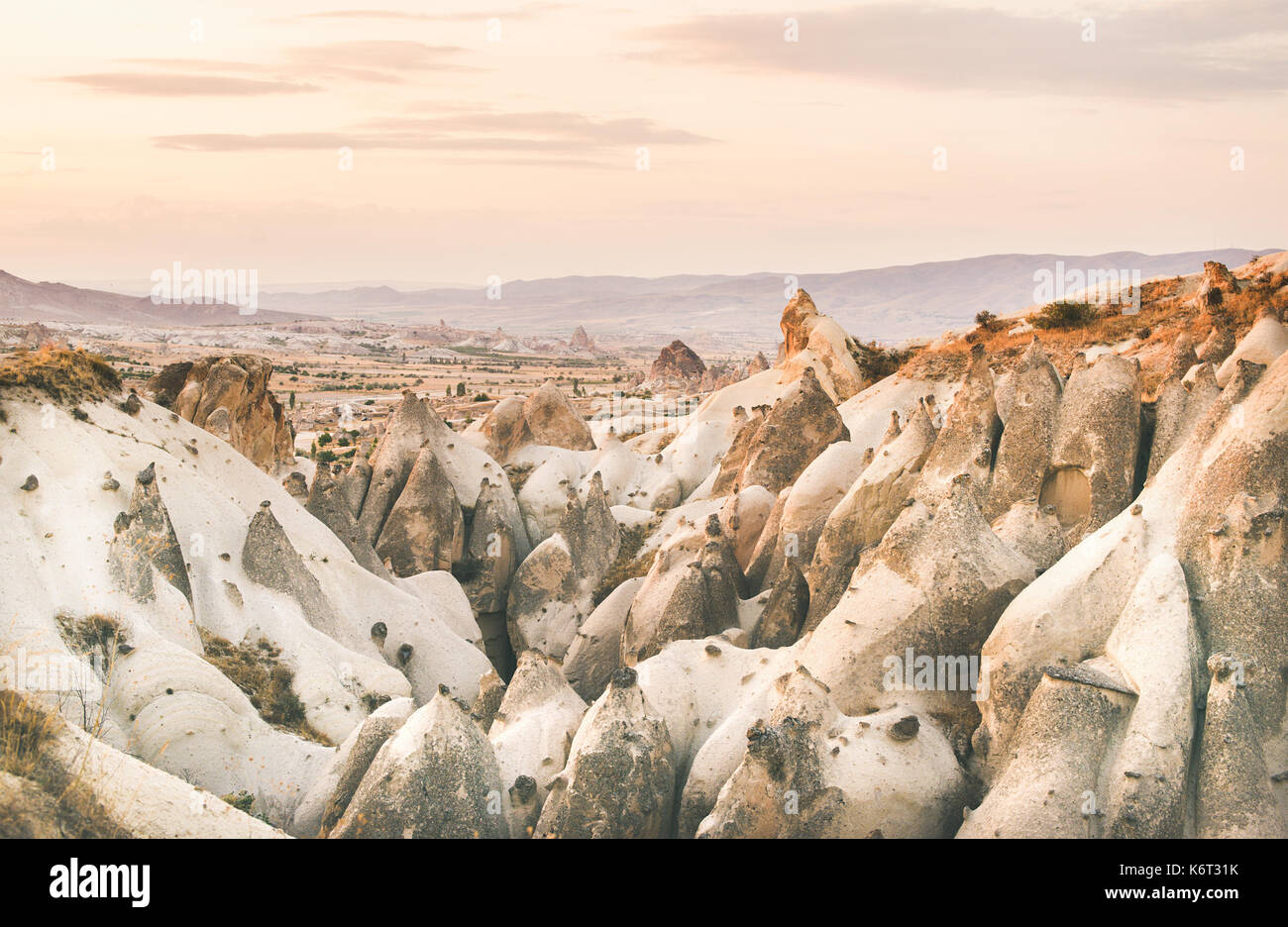 Valley with volcanic tuff stone rocks in Cappadocia Stock Photo - Alamy