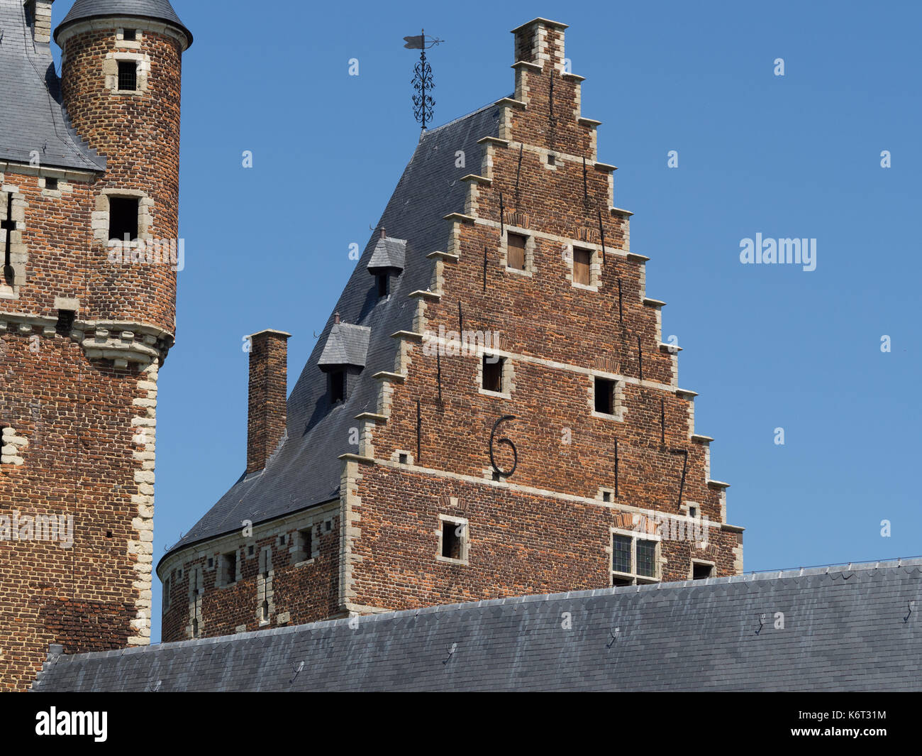 A close up of the facades and towers of a medieval castle in Beersel ...