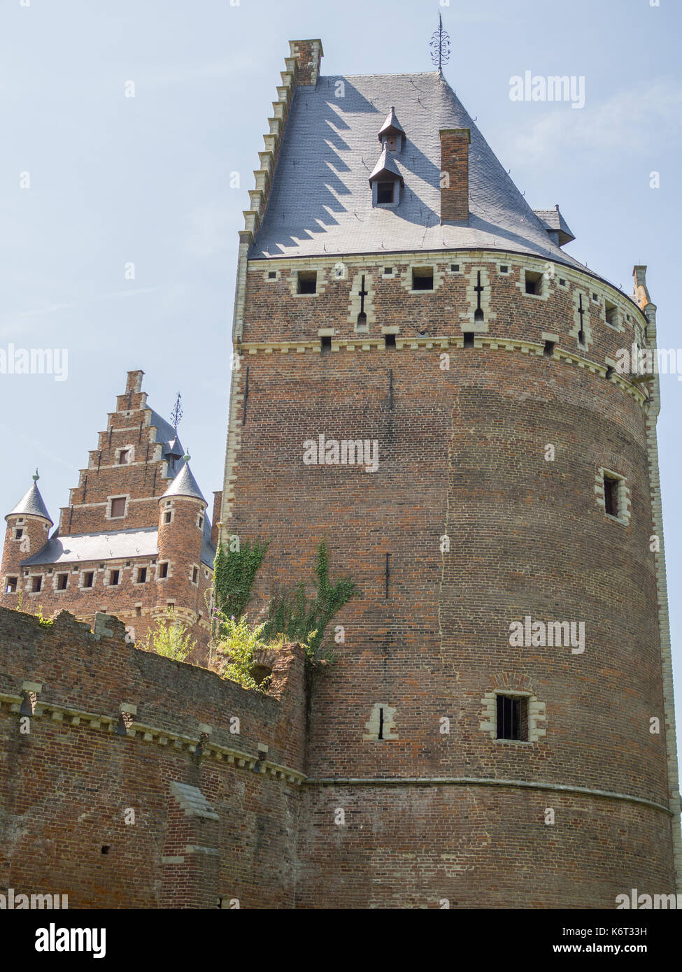 A close up of the facades and towers of a medieval castle in Beersel ...