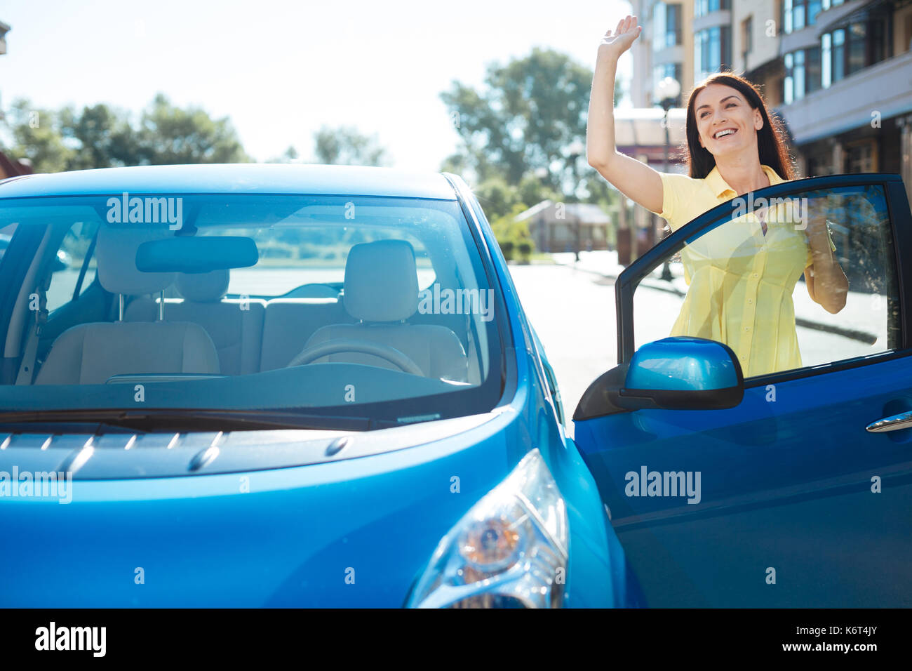 Woman and driver waving hi-res stock photography and images - Alamy