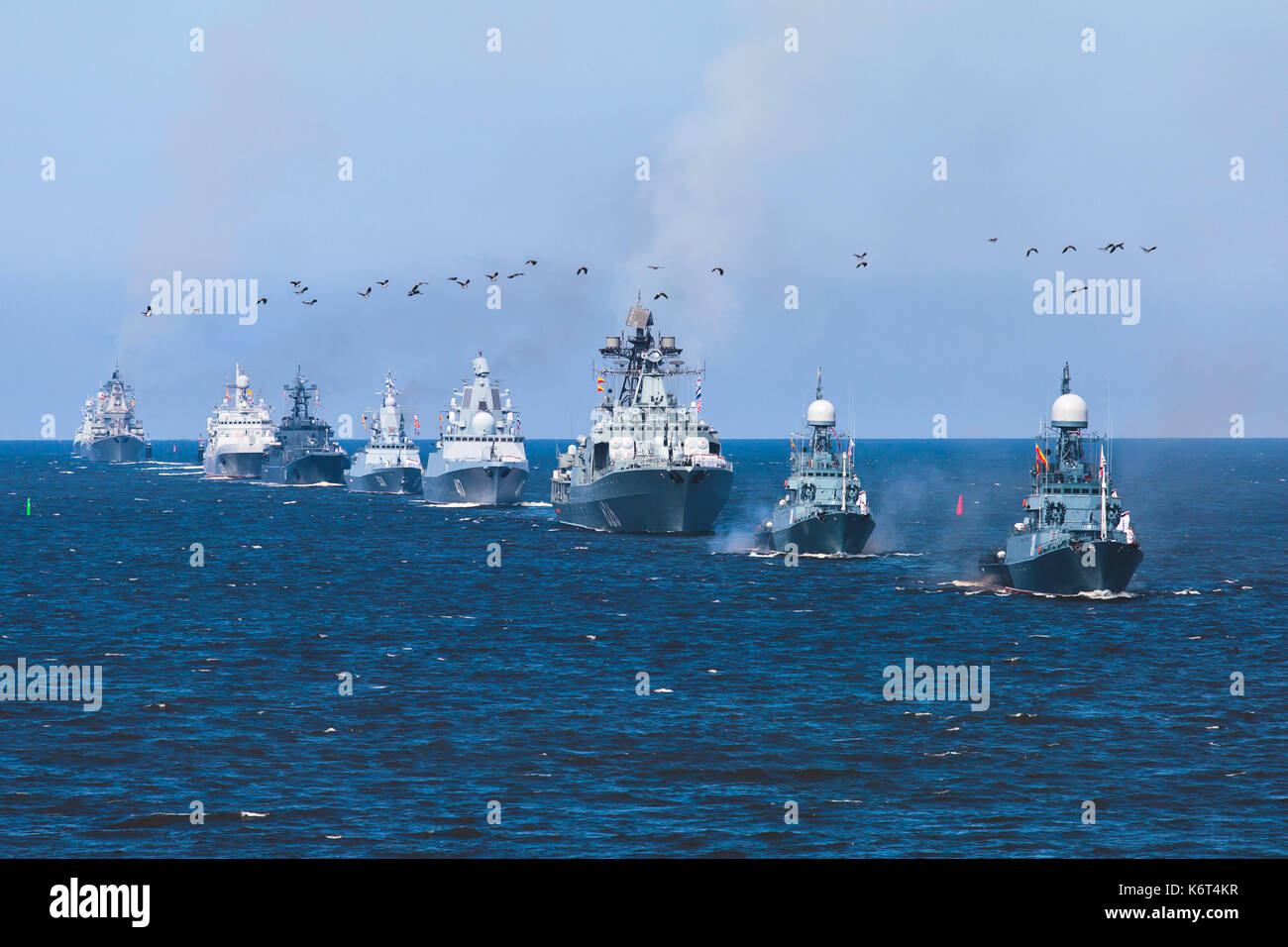 A line of modern russian military naval battleships warships in the row ...