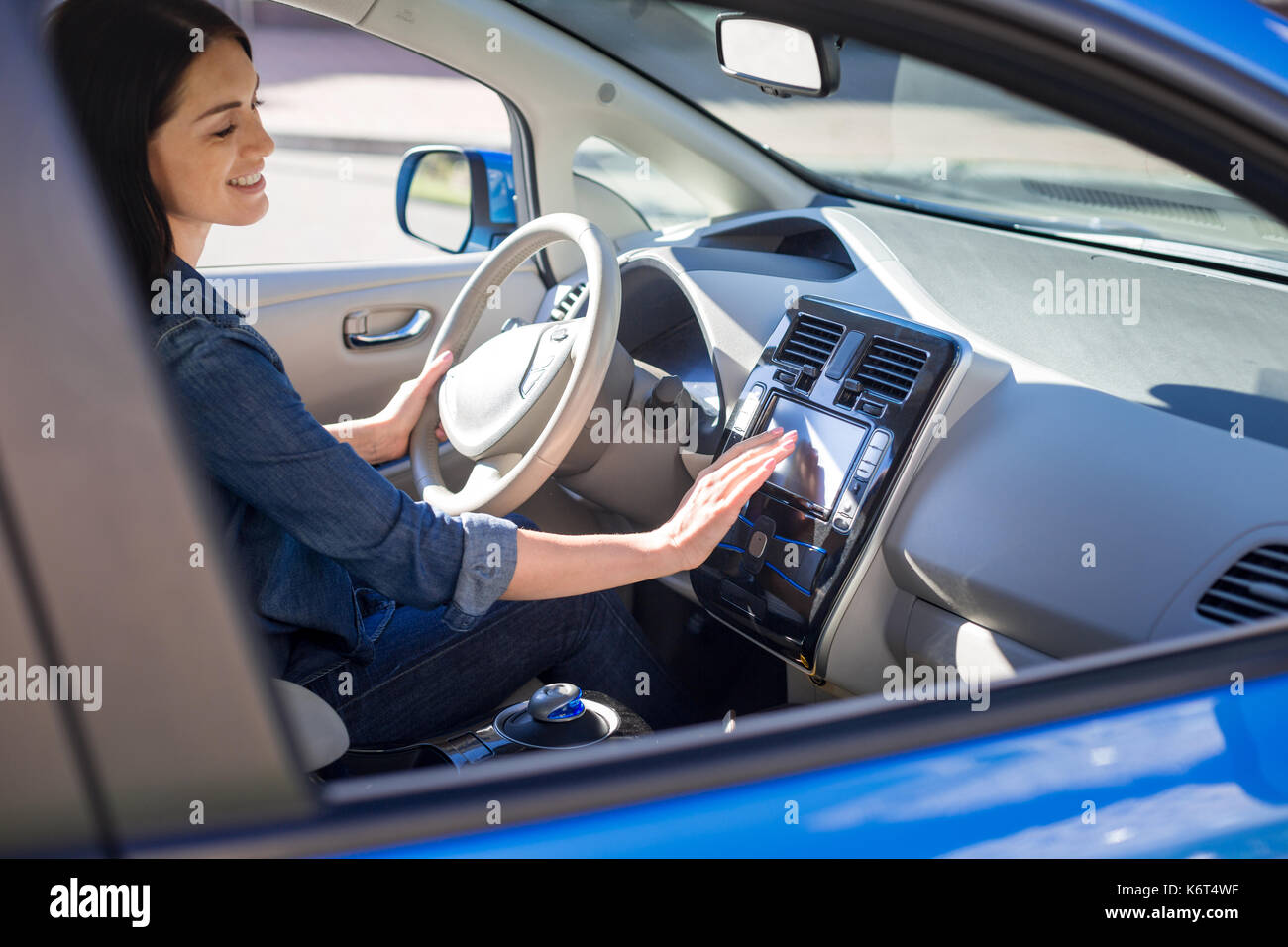 Beautiful smart woman sitting in her car Stock Photo - Alamy