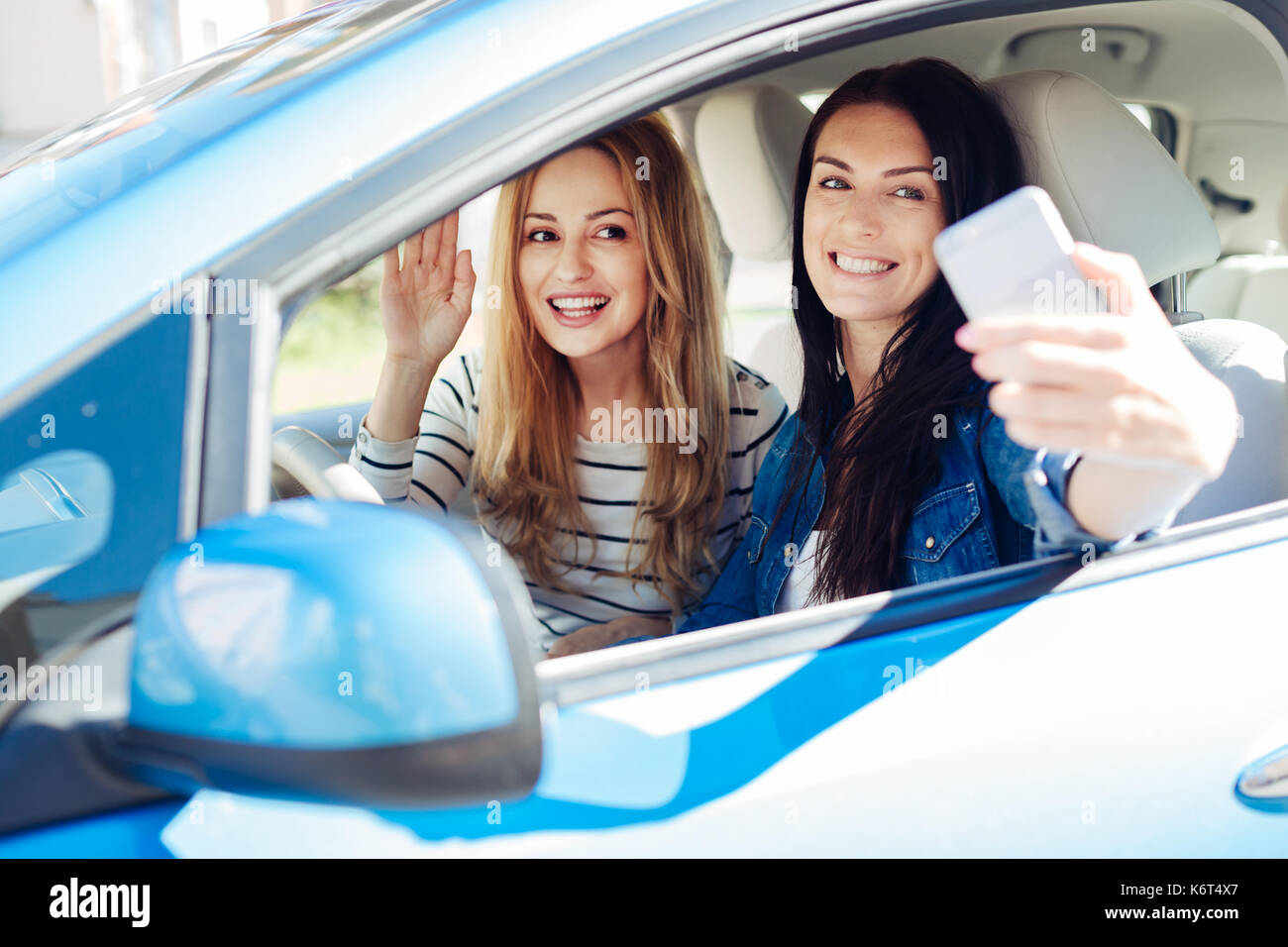 Attractive beautiful women talking a selfie Stock Photo - Alamy
